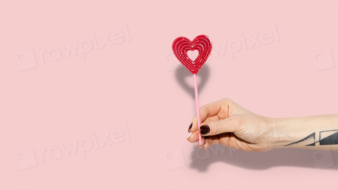 Woman holding red heart stick | Premium Photo - rawpixel