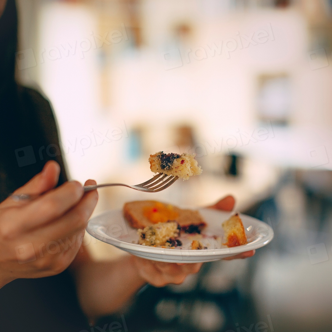Woman eating while standing | Free Photo - rawpixel