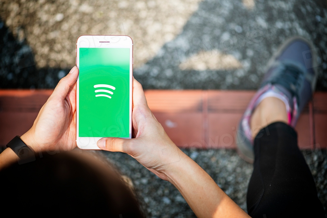Spotify application noticed mobile phone. | Free Photo - rawpixel