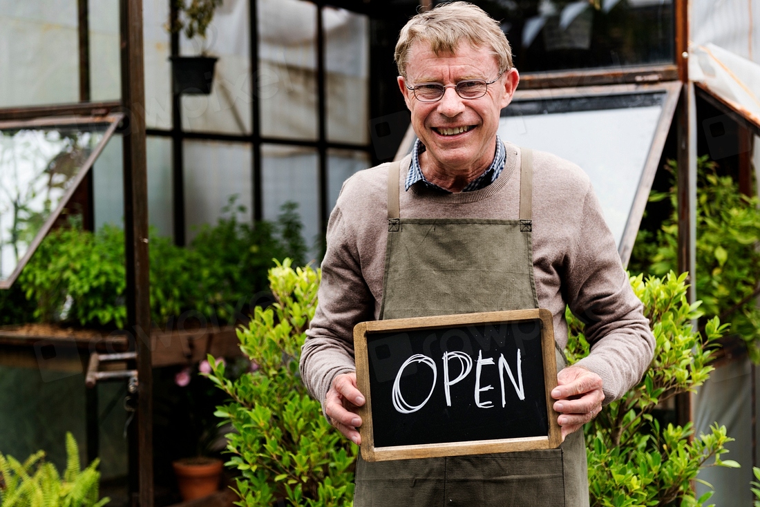 Old man holding open sign | Premium Photo - rawpixel