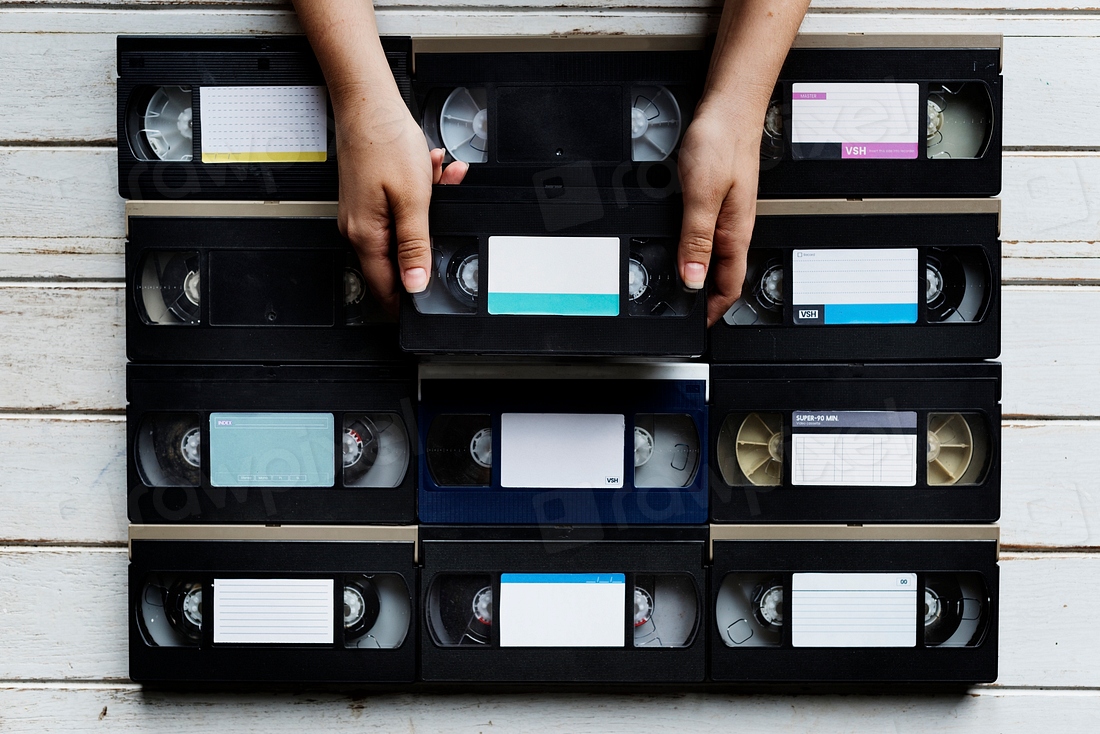 Hands holding selecting a videotape | Premium Photo - rawpixel