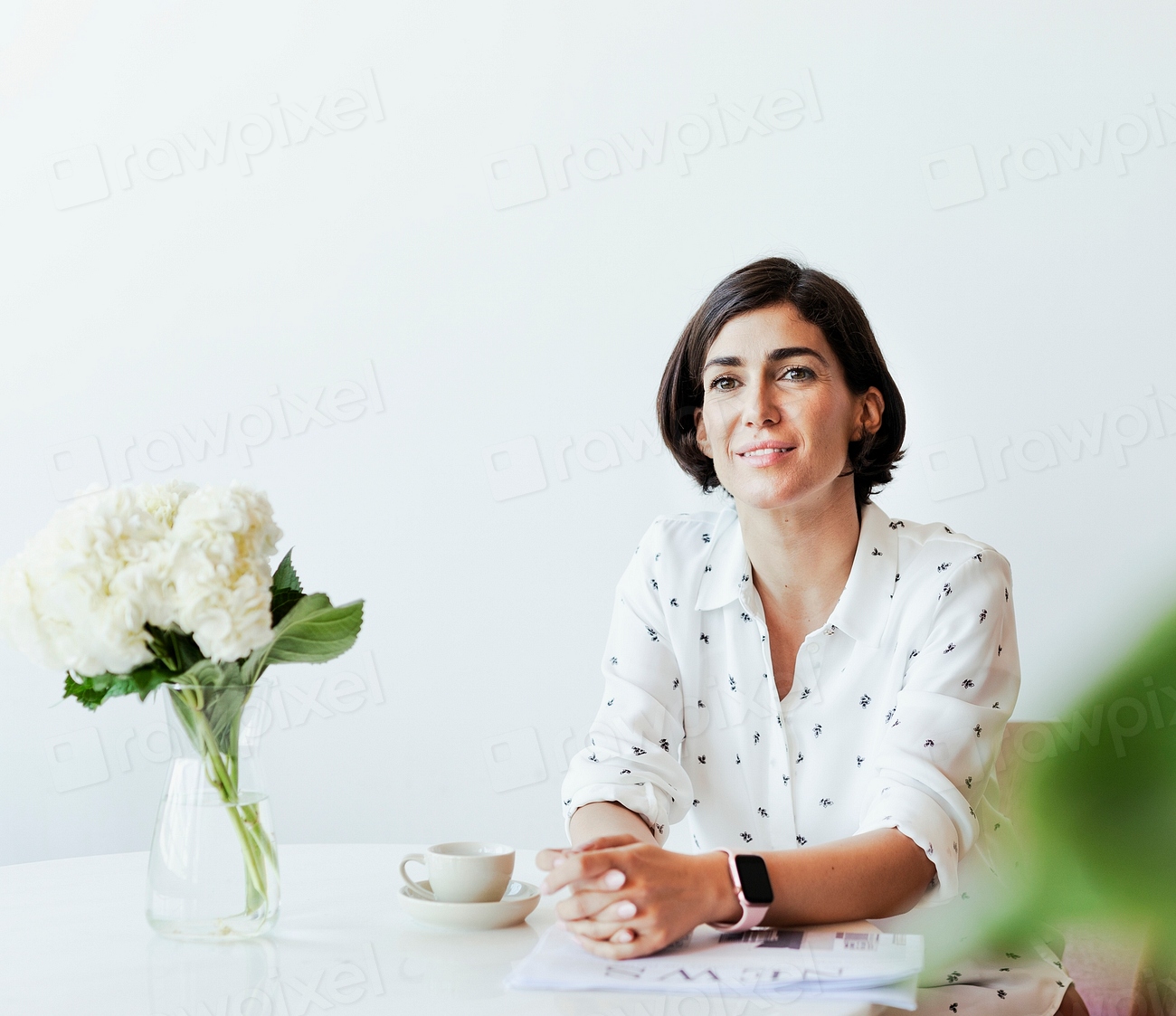 Happy woman wearing smartwatch sitting | Premium Photo - rawpixel