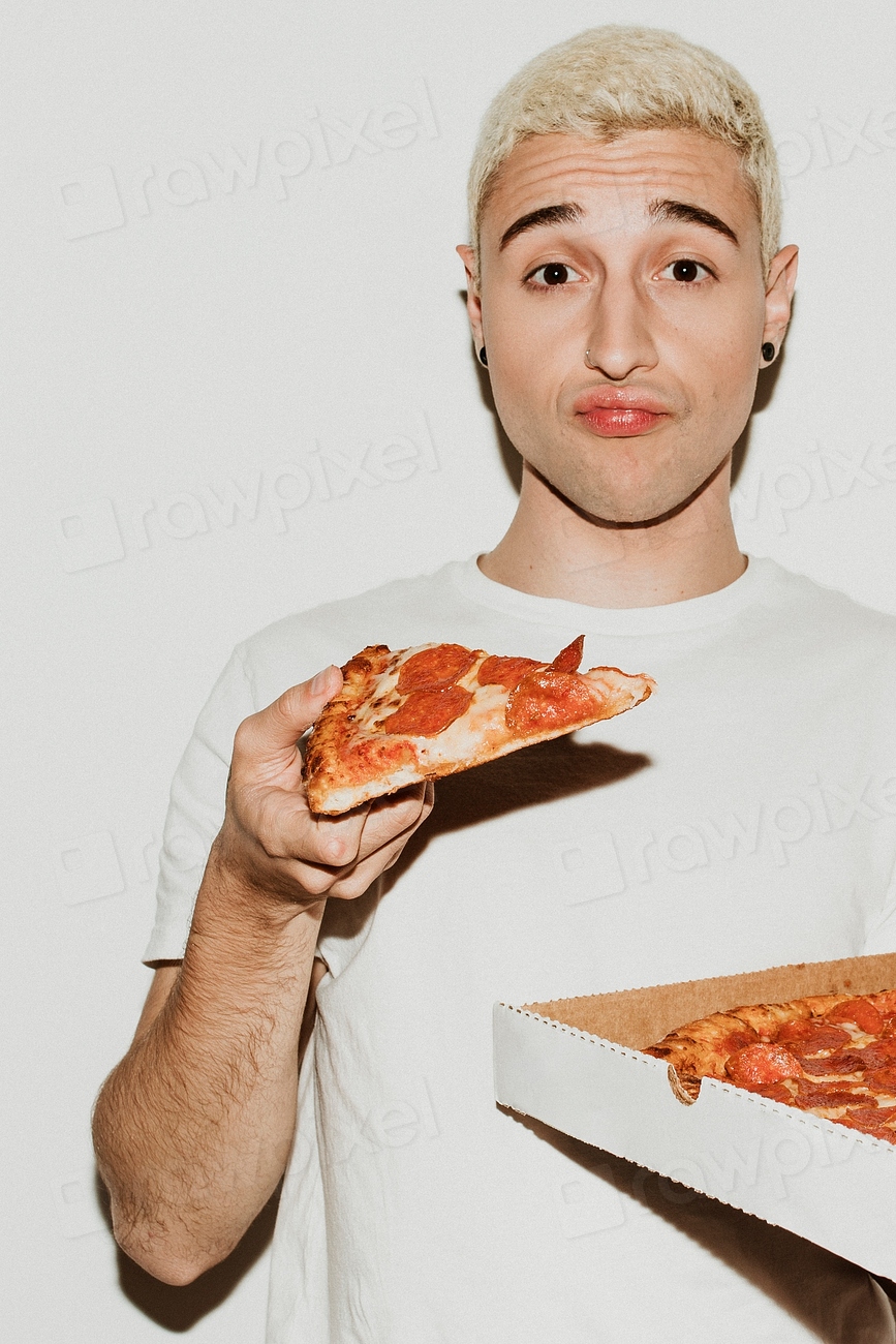 man having pepperoni pizza | Premium Photo - rawpixel