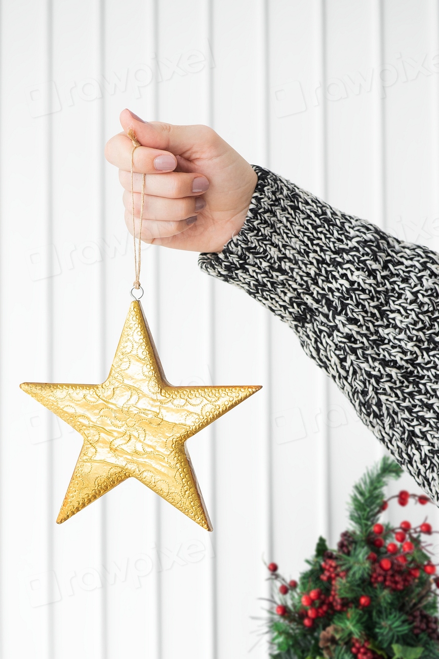 Woman holding glittery gold star | Premium Photo - rawpixel