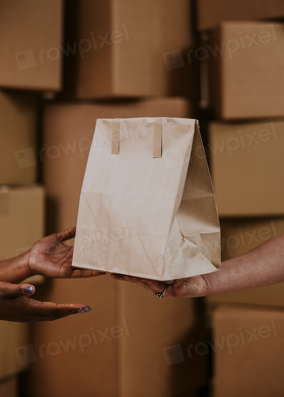 Food delivery man handing bag | Premium Photo - rawpixel
