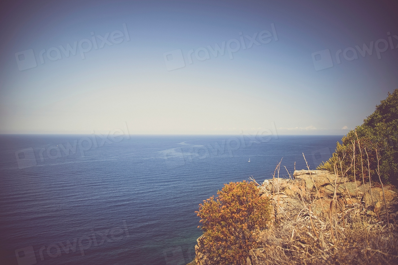 Cliff by a beautiful sea | Free Photo - rawpixel