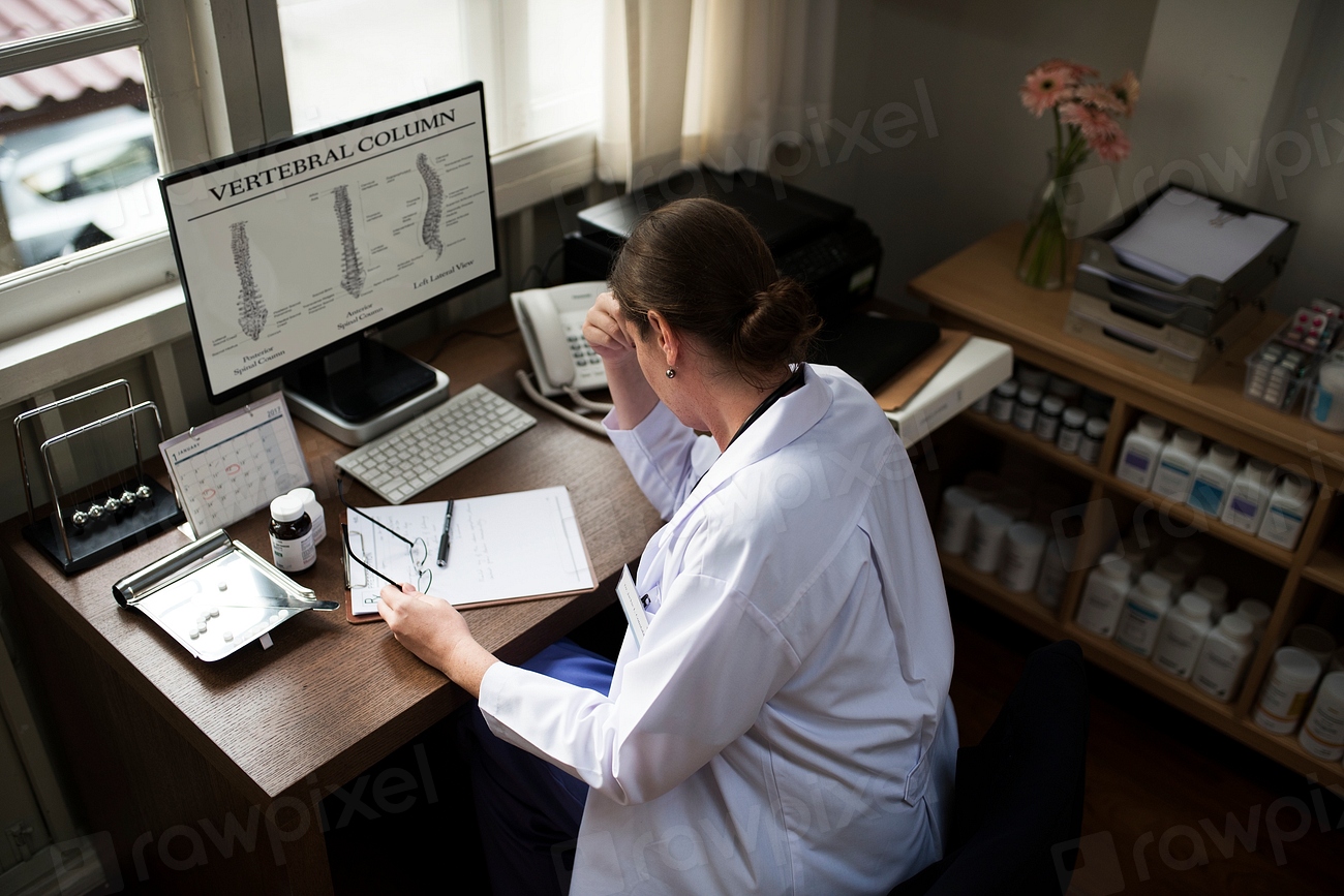 Stressed doctor working hospital office | Premium Photo - rawpixel