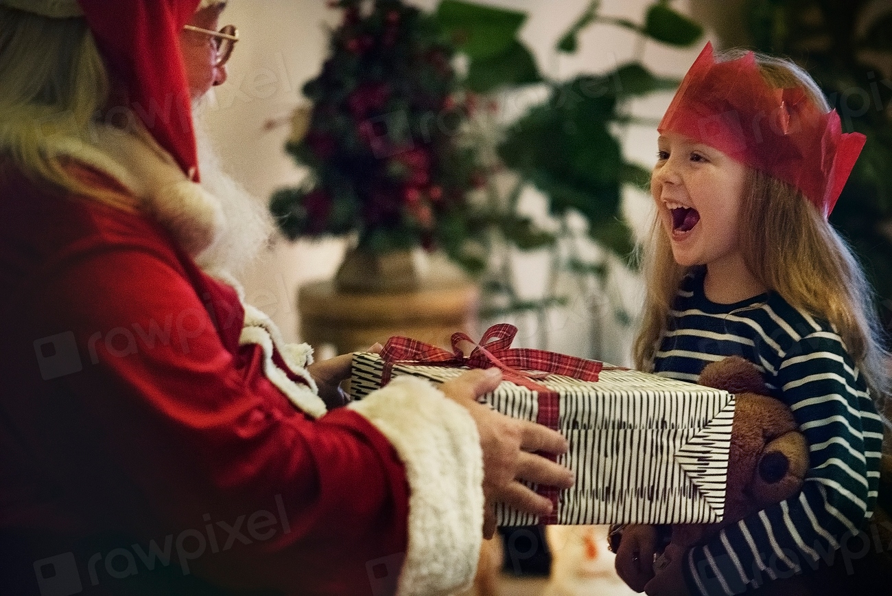 Santa Claus giving out a gift | Premium Photo - rawpixel