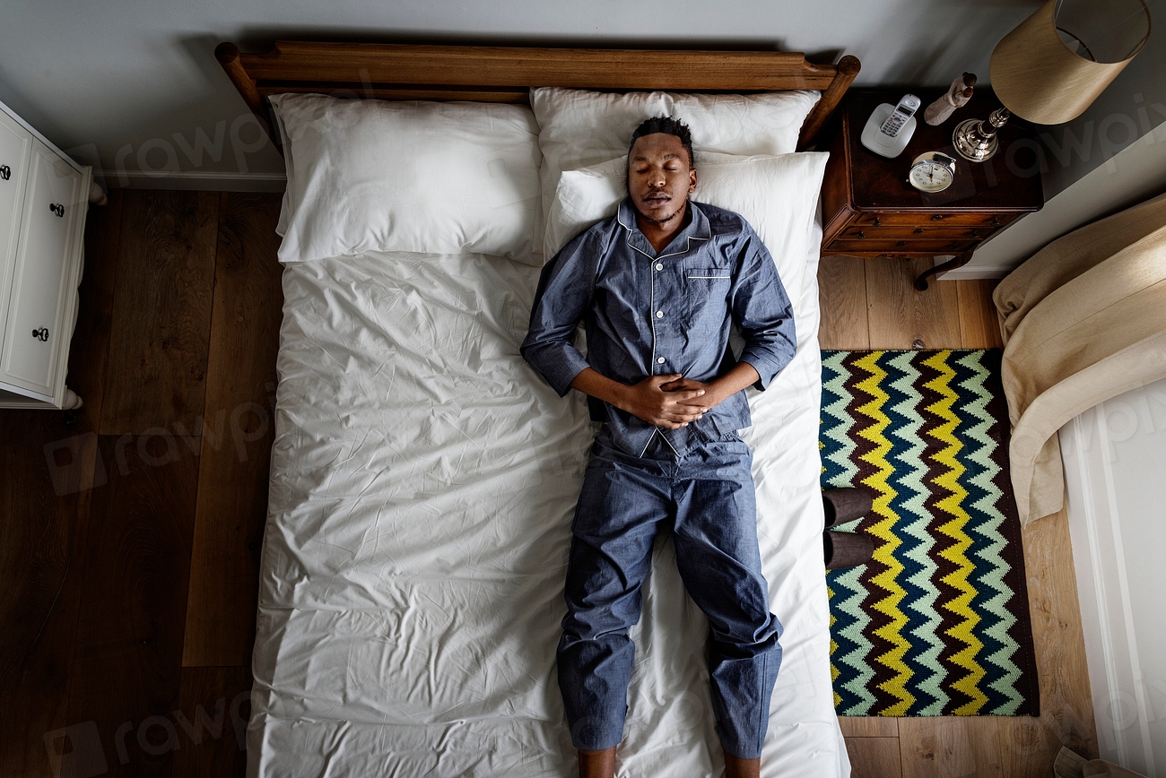 Lonely man sleeping alone on the bed | Premium Photo - rawpixel