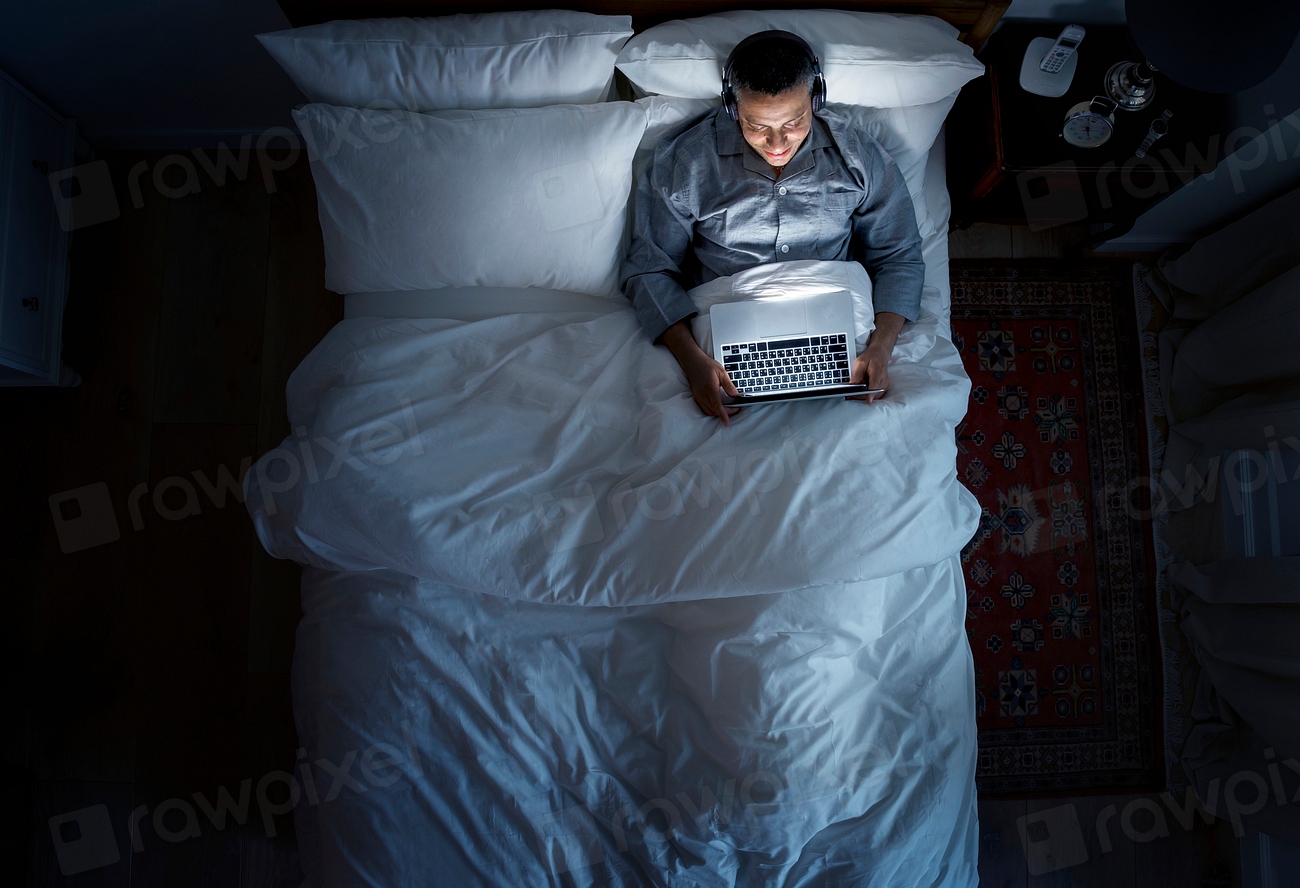 Man bed using his laptop | Premium Photo - rawpixel