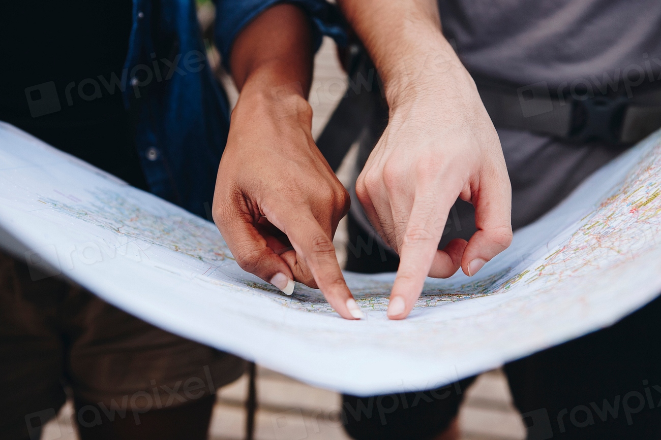 Friends finding directions with a map | Photo - rawpixel