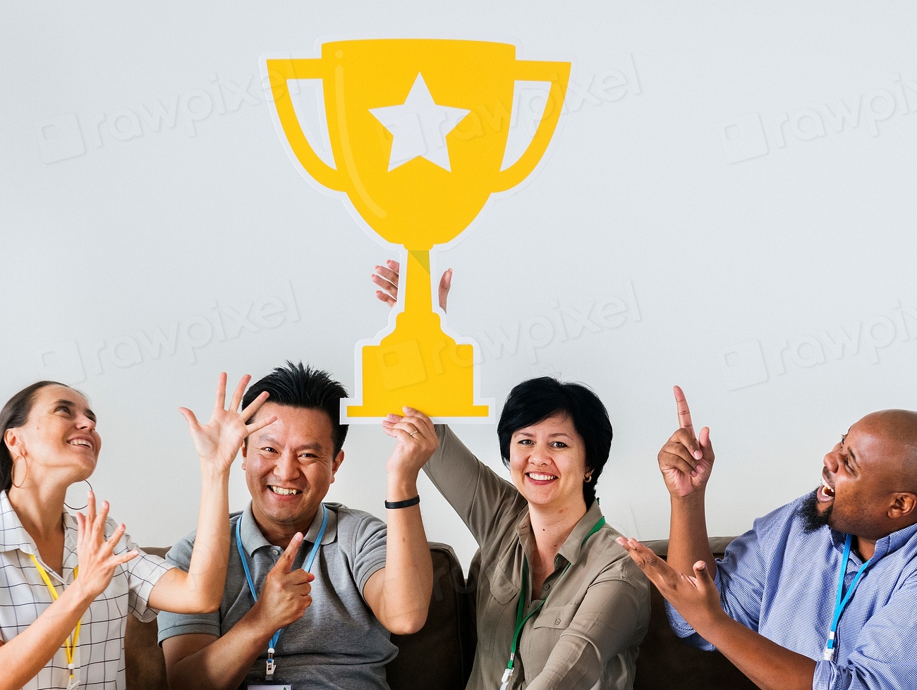 Workers celebrating their success with a trophy | Free Photo - rawpixel