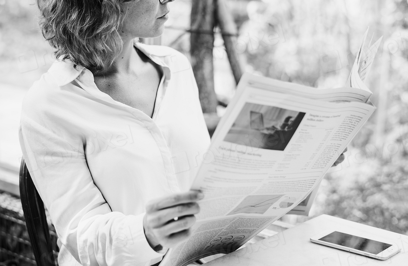 Business woman reading newspaper morning | Free Photo - rawpixel