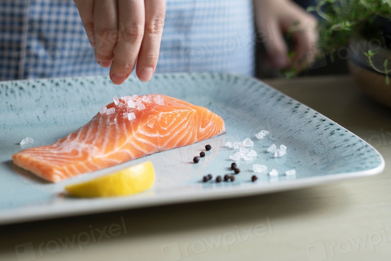 A person seasoning a fillet | Premium Photo - rawpixel