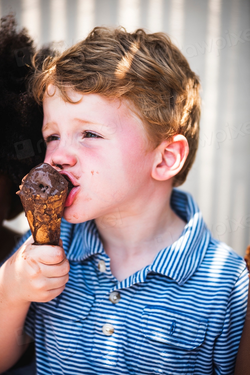 Cute kid having chocolate ice | Free Photo - rawpixel