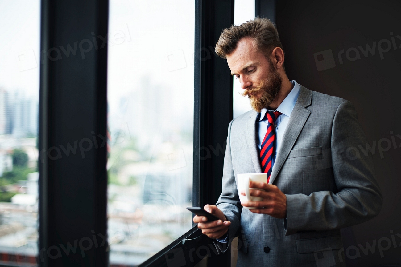 Businessman using phone and drinking | Premium Photo - rawpixel