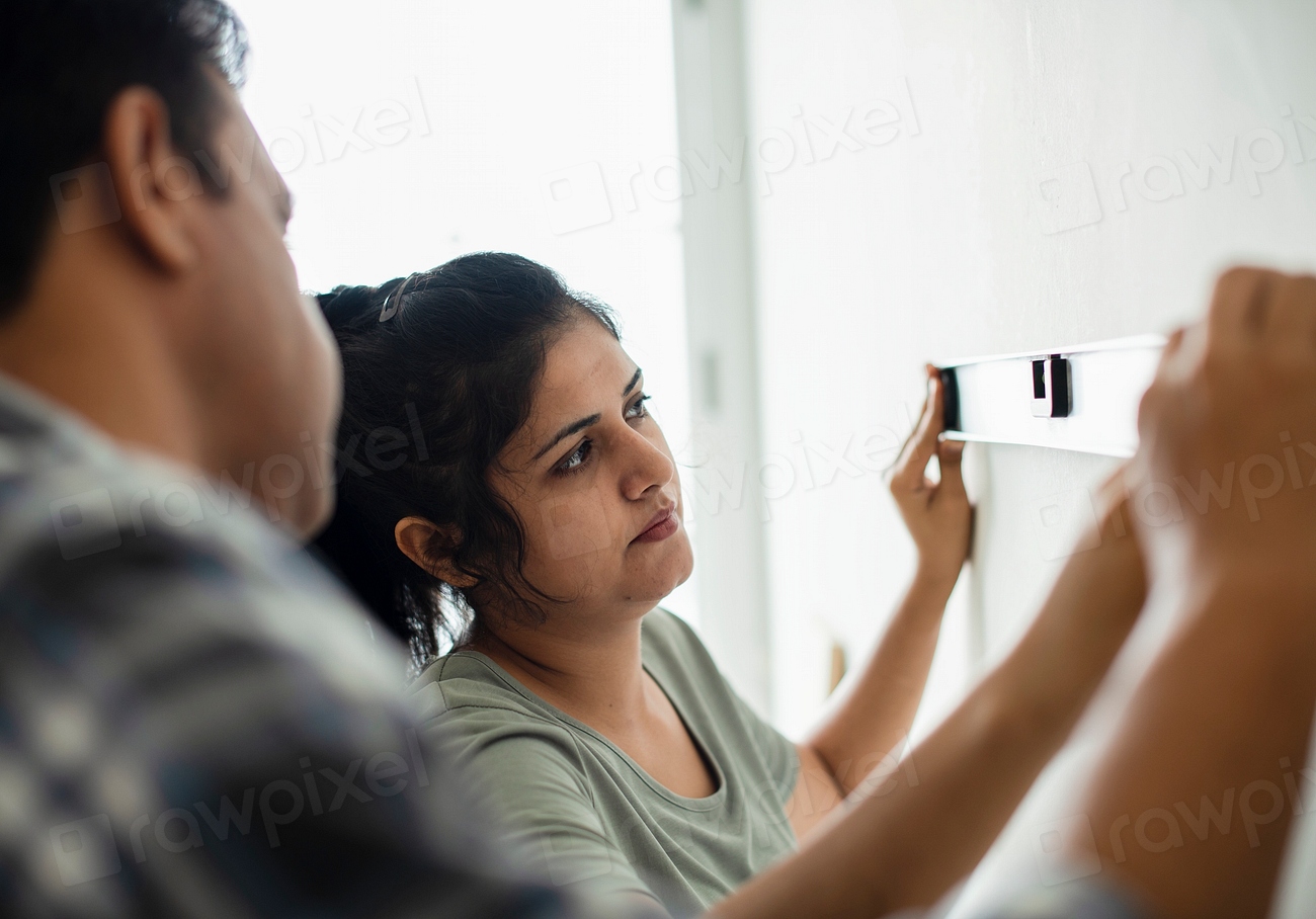 Woman using spirit level wall | Premium Photo - rawpixel