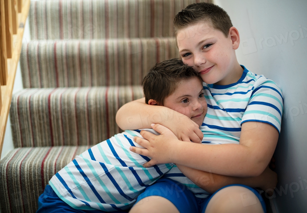 Brothers hugging at the stairs | Free Photo - rawpixel