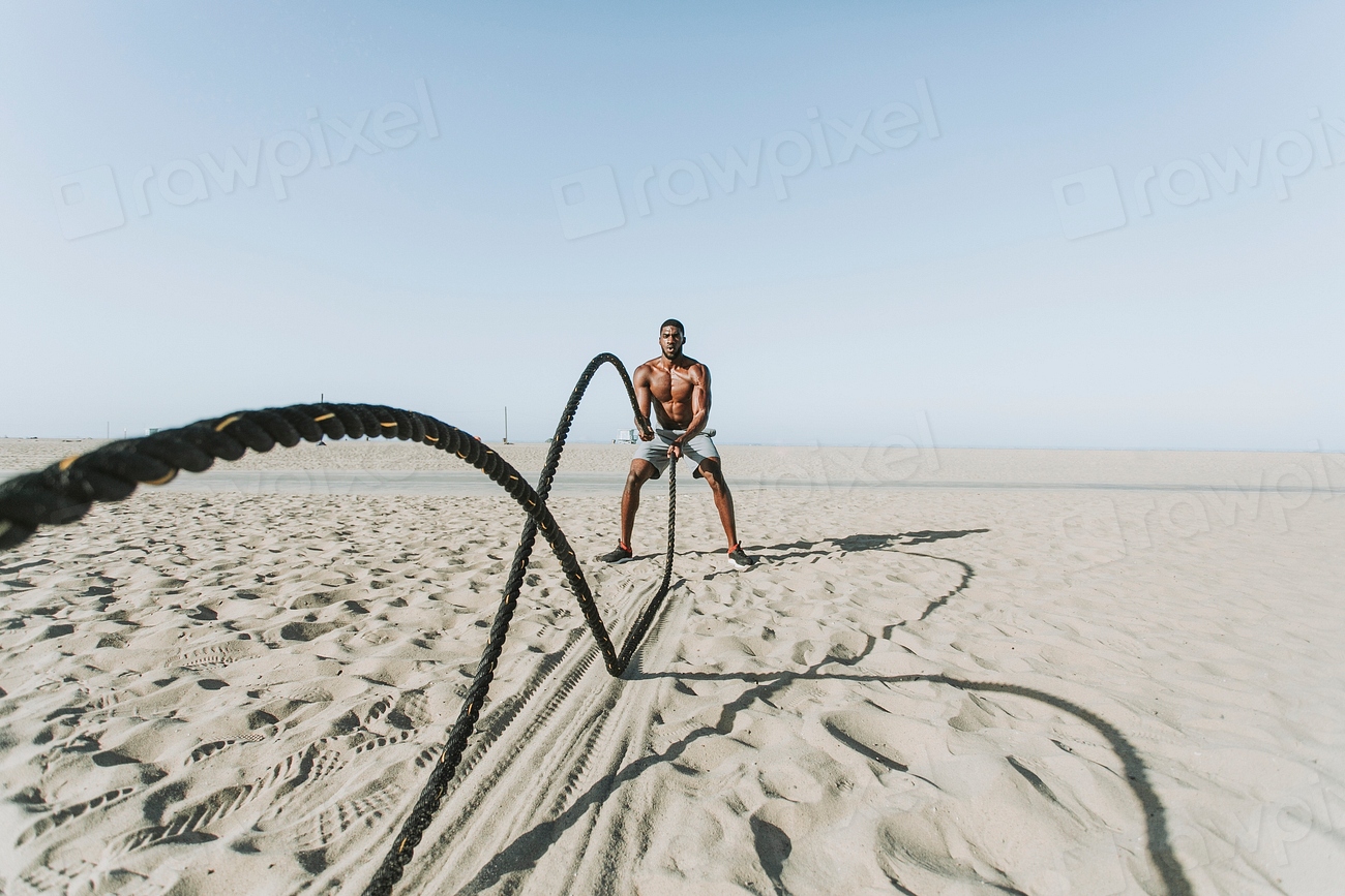 Fit man working battle ropes | Premium Photo - rawpixel