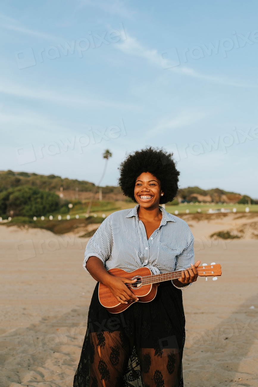 African American musician playing ukulele | Premium Photo - rawpixel