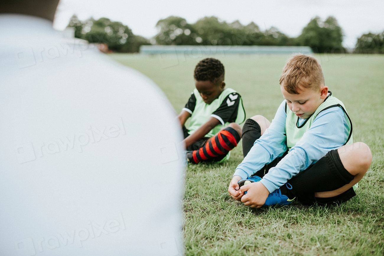 Young football kids stretching field | Free Photo - rawpixel