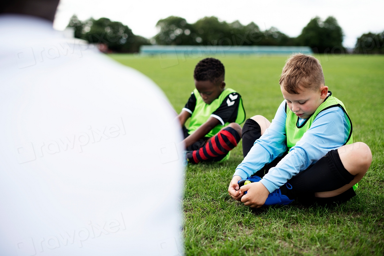 Young football kids stretching field | Premium Photo - rawpixel
