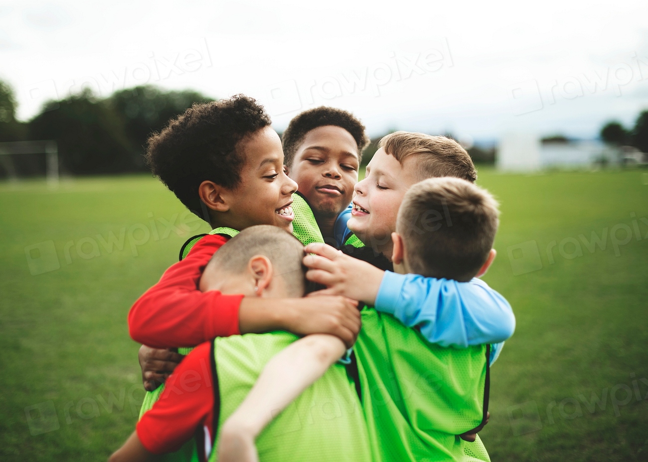 Junior football team hugging each | Premium Photo - rawpixel