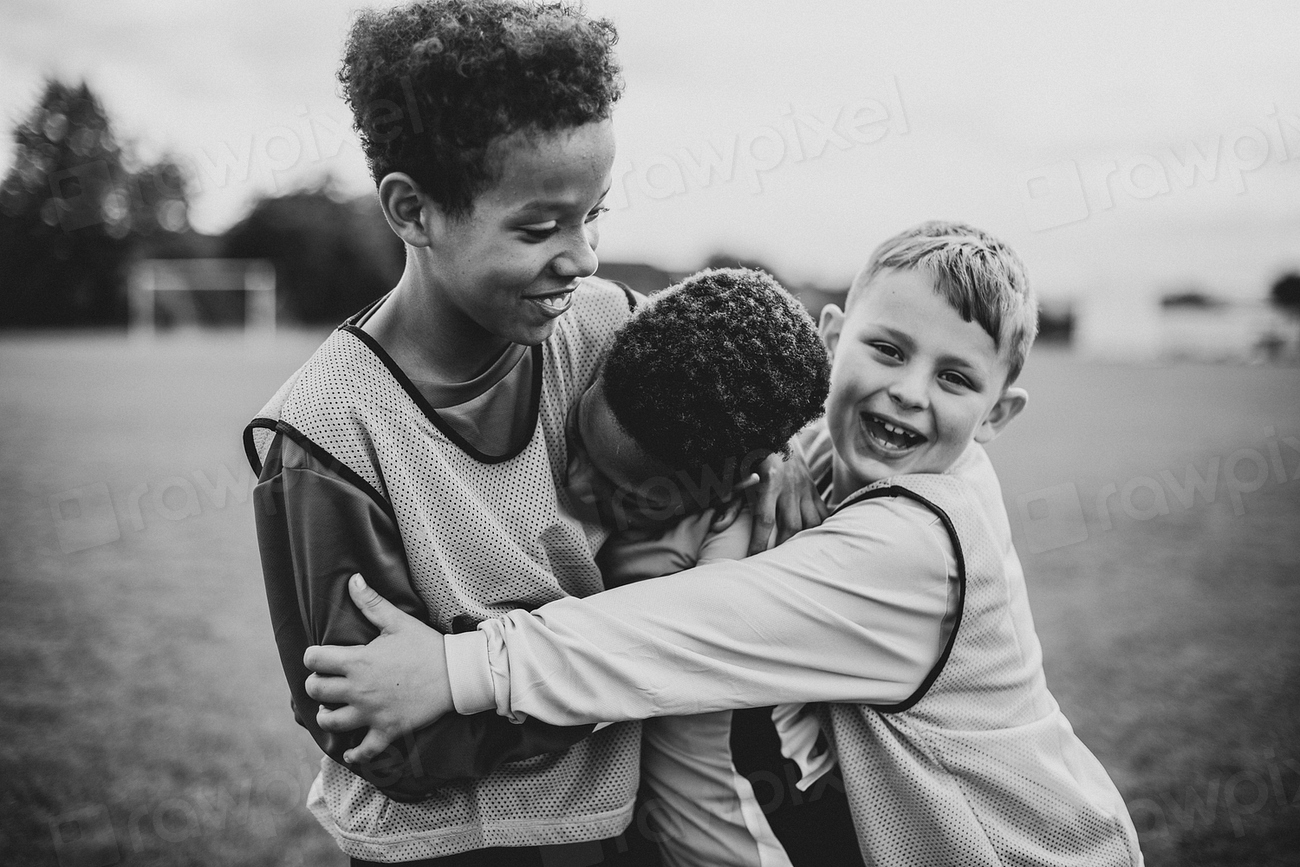 Junior football team hugging each | Free Photo - rawpixel