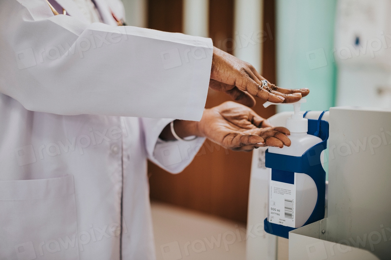 Female physician disinfecting her hands | Premium Photo - rawpixel