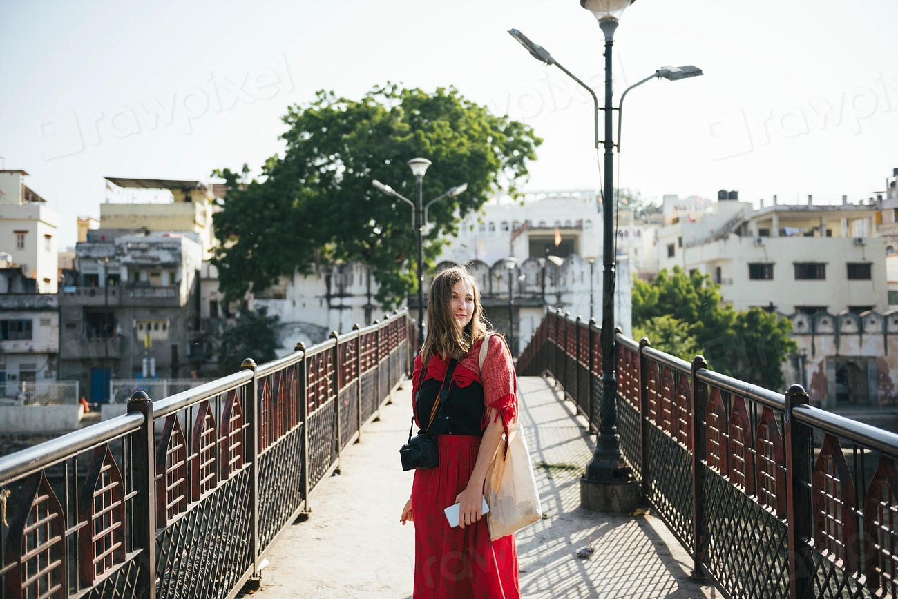 Western woman bridge city Udaipur, | Free Photo - rawpixel
