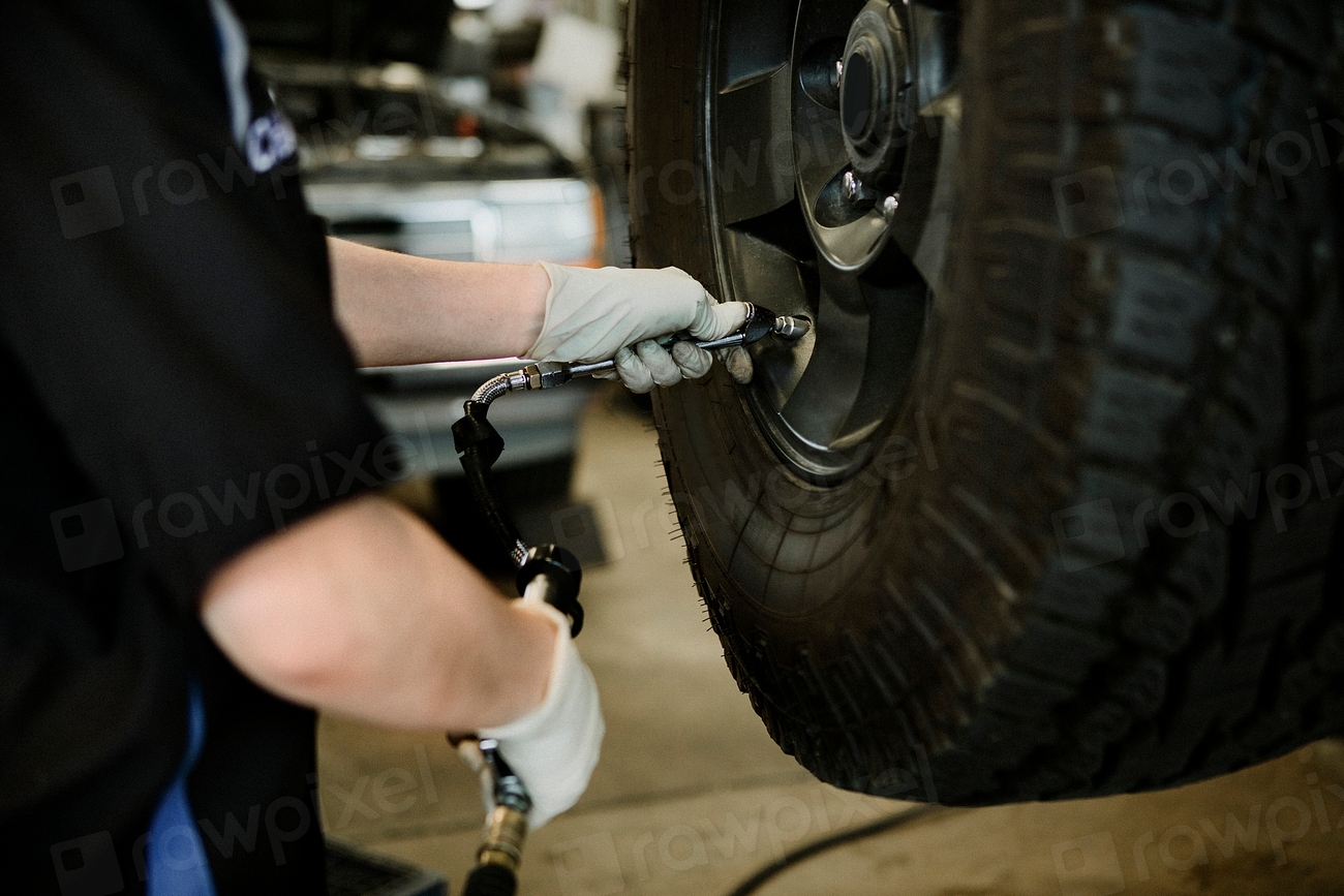 Mechanic filling air tires | Premium Photo - rawpixel