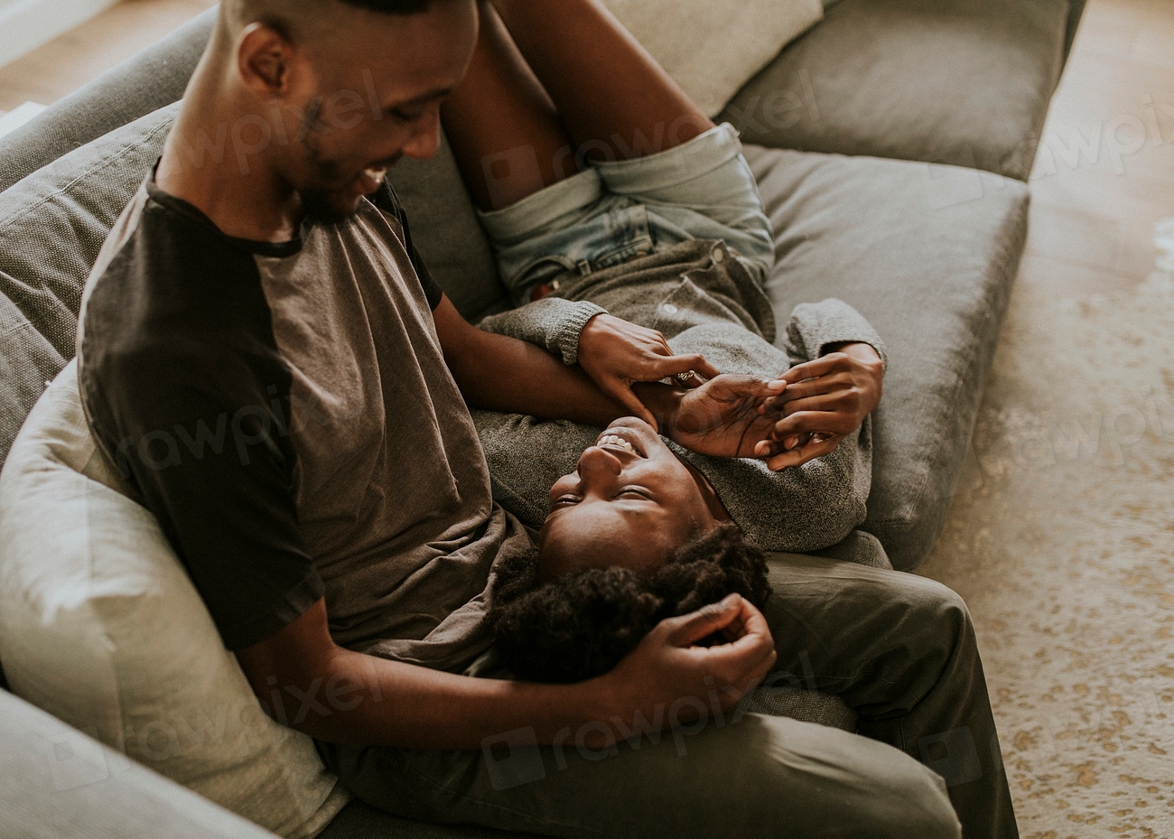 African couple chilling living room | Premium Photo - rawpixel