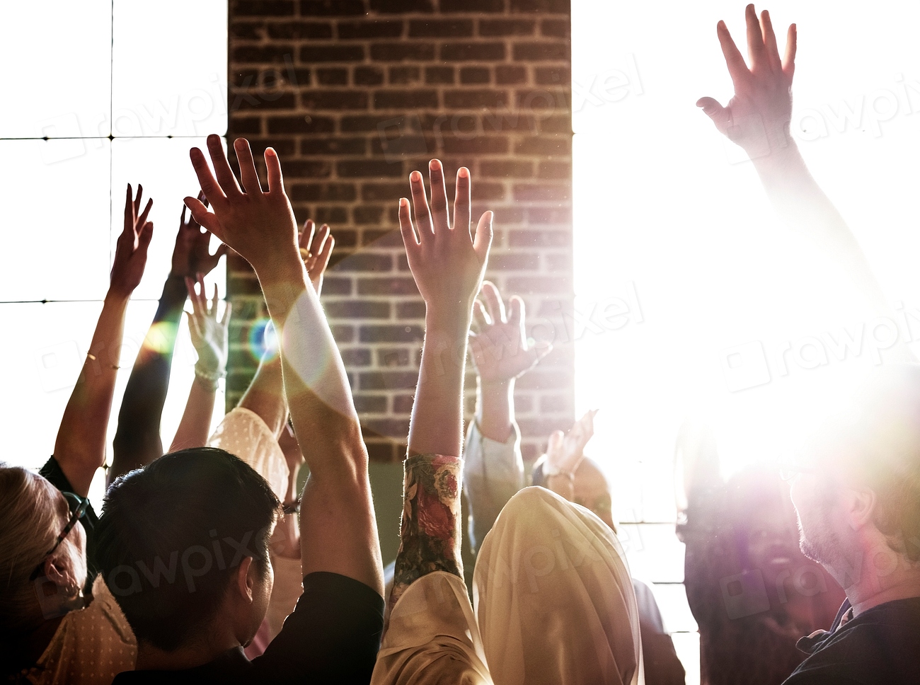People raising their hands seminar | Premium Photo - rawpixel