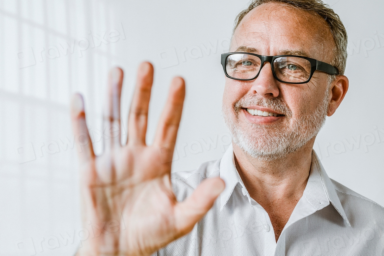 Man pressing his palm to a screen | Premium Photo - rawpixel