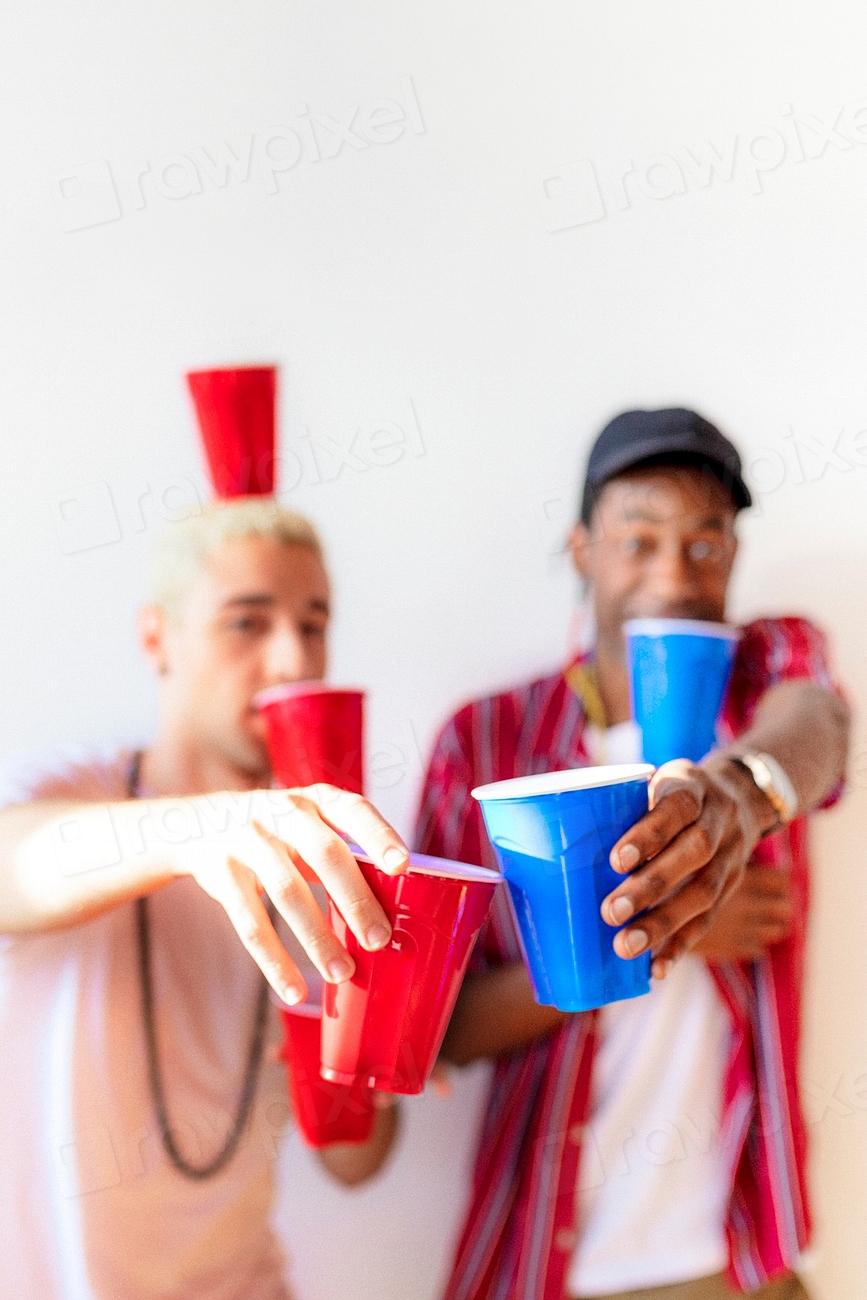 Cheerful young men holding cups | Premium Photo - rawpixel