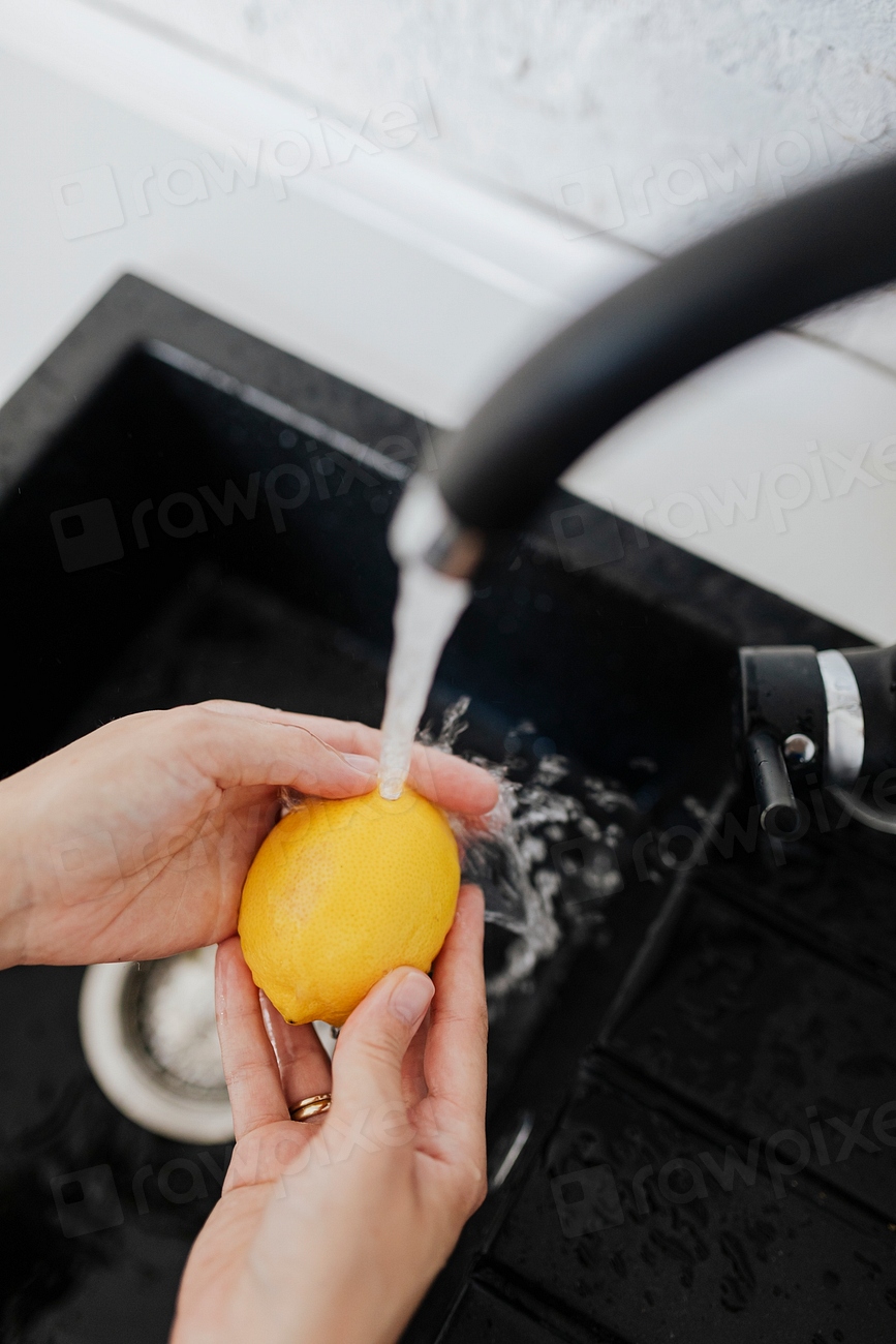 Woman rinsing yellow lemon sink | Free Photo - rawpixel