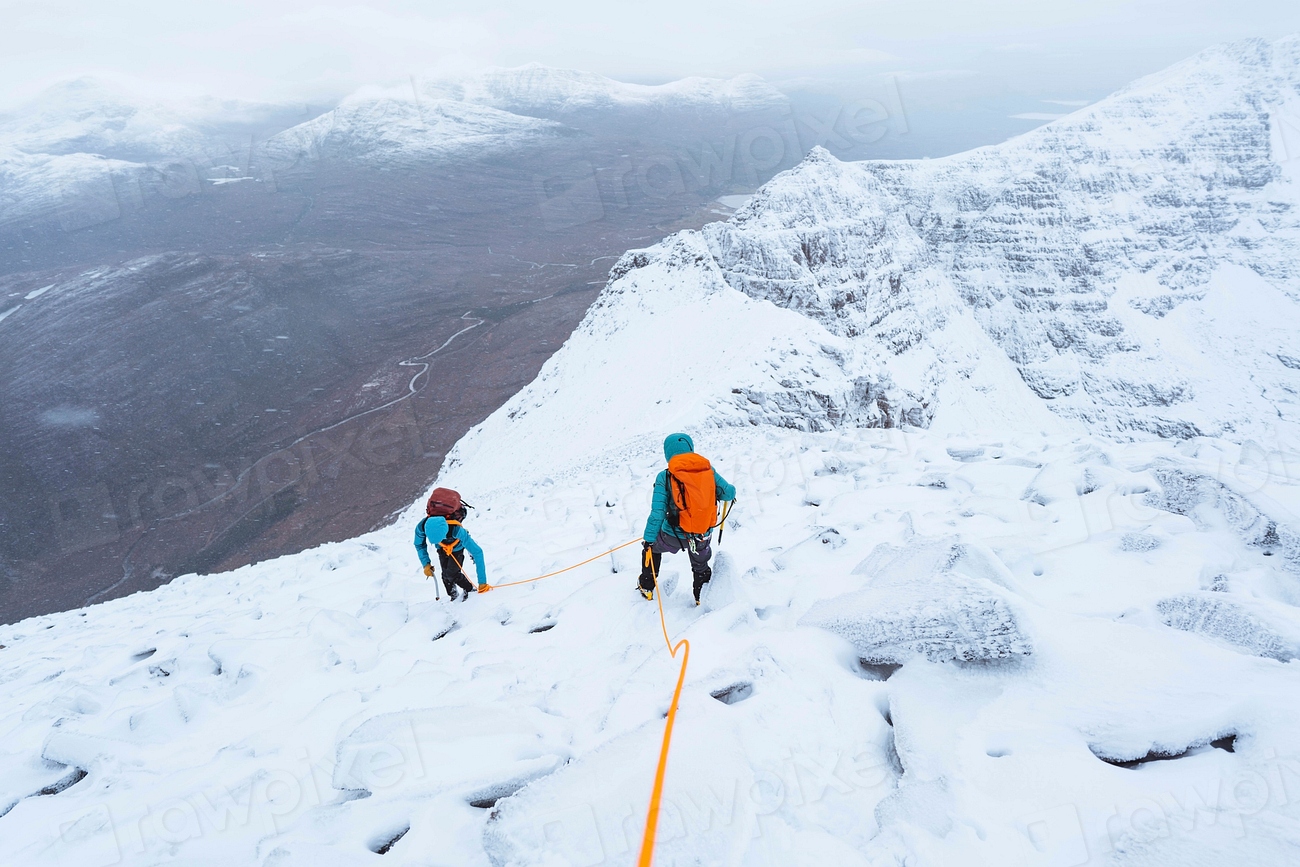 Mountaineers climbing snowy Liathach Ridge | Premium Photo - rawpixel