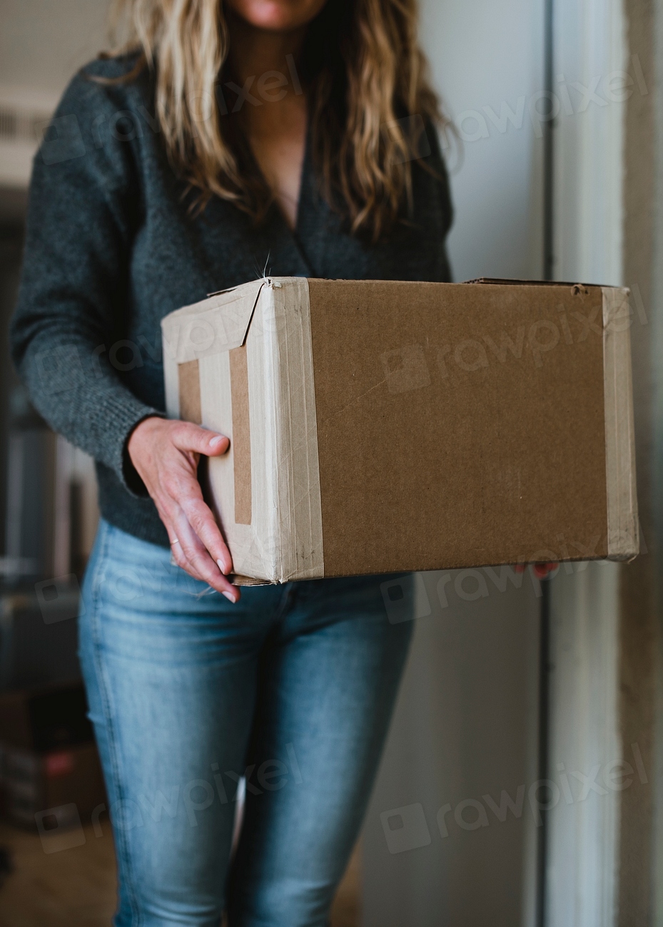 Woman getting her package front | Free Photo - rawpixel