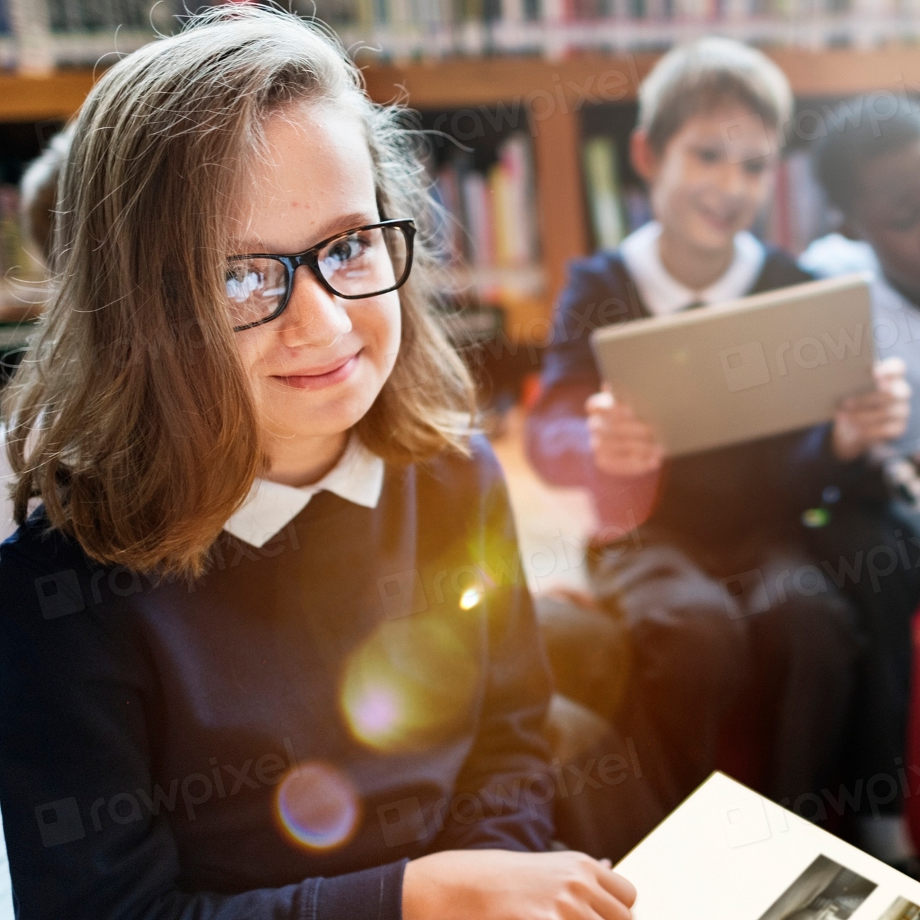 Young students at the library | Free Photo - rawpixel