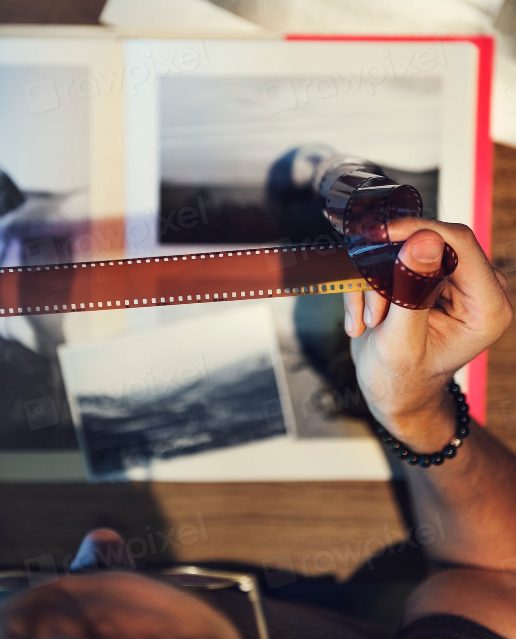 Photographer looking at some film | Premium Photo - rawpixel