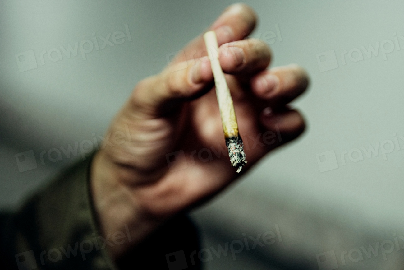 Closeup of hand holding cigarette | Premium Photo - rawpixel