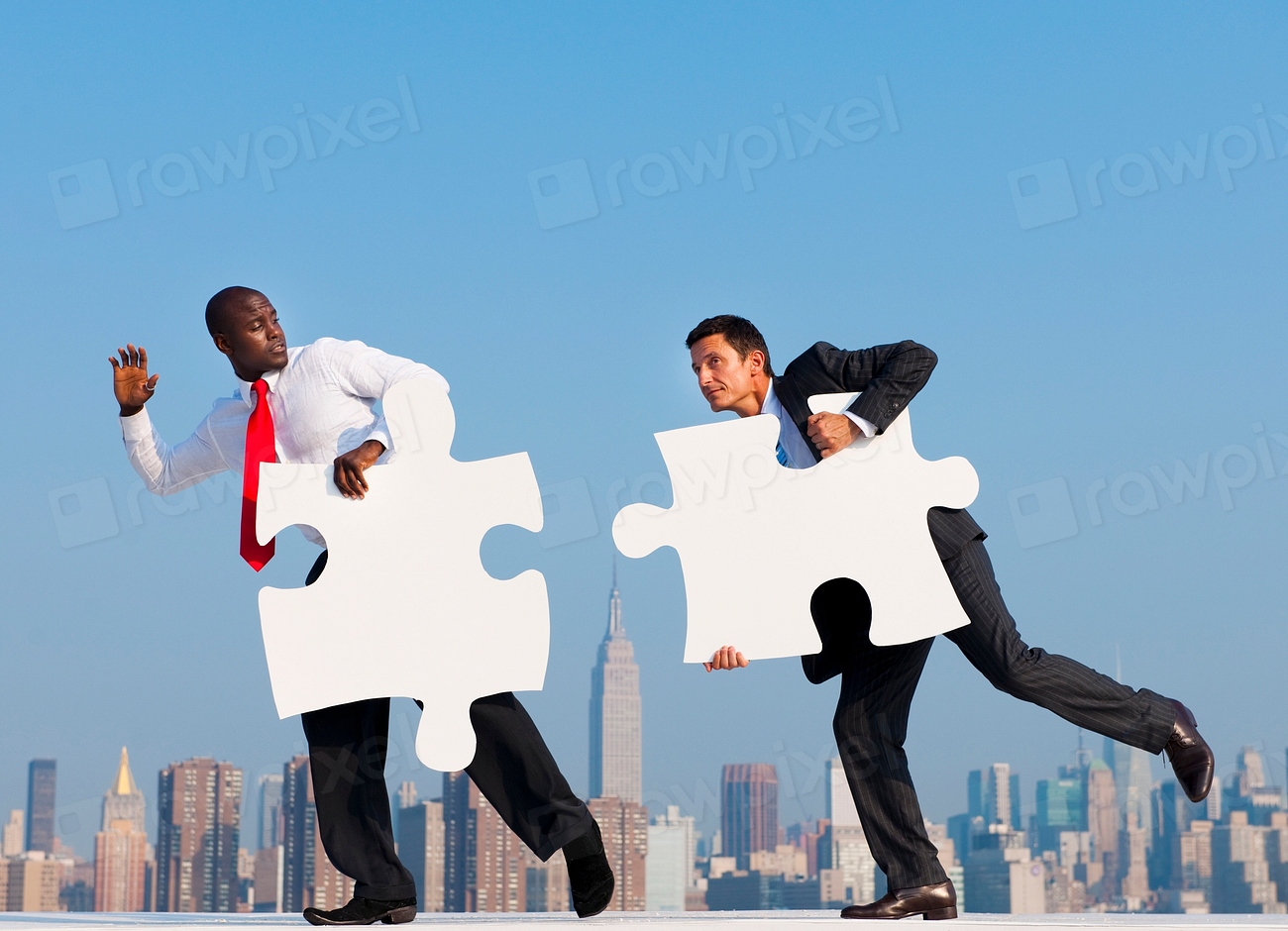 Two businessmen solving a puzzle | Premium Photo - rawpixel