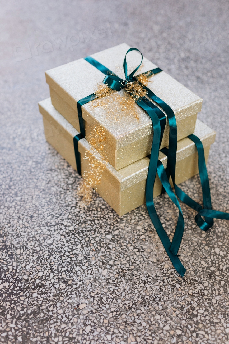 Wrapped golden gift boxes floor | Premium Photo - rawpixel