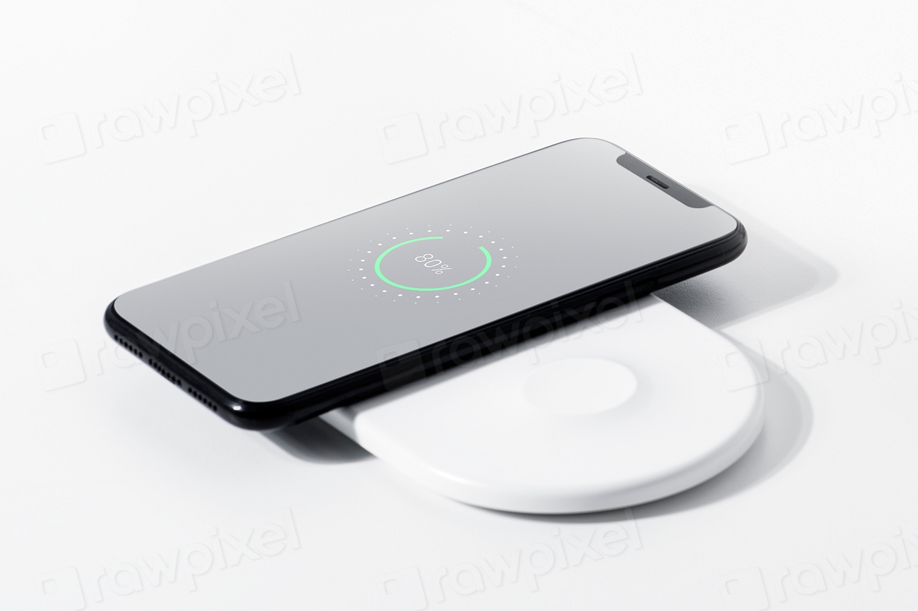 Smartphone on white wireless charger | Premium Photo - rawpixel