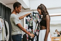 Stylist choosing an outfit for the model | Premium Photo - rawpixel