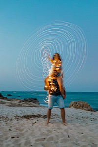 Woman riding man's shoulder beach | Premium Photo - rawpixel