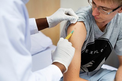 Young man having a vaccination | Free Photo - rawpixel