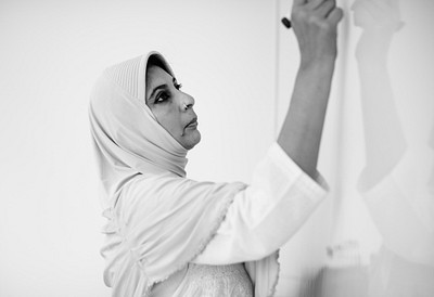 Muslim teacher is writing white | Premium Photo - rawpixel