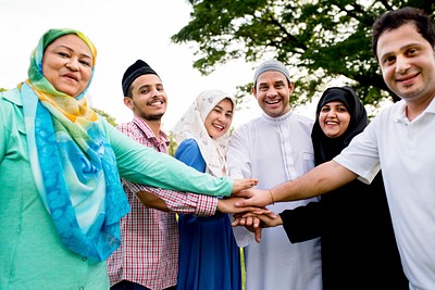 Muslim group of friends stacking | Photo - rawpixel