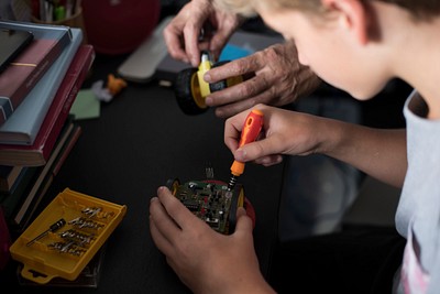 Young boy learning about electronics | Premium Photo - rawpixel
